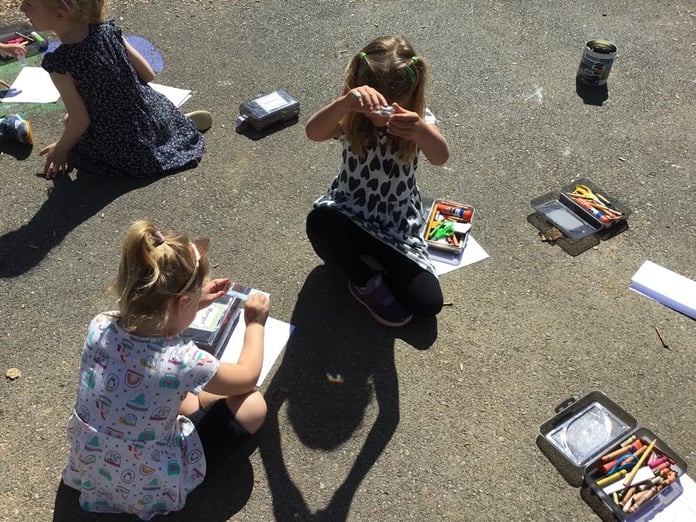 Pre-Kindergarten Makes Rainbow Using Triangular Prisms